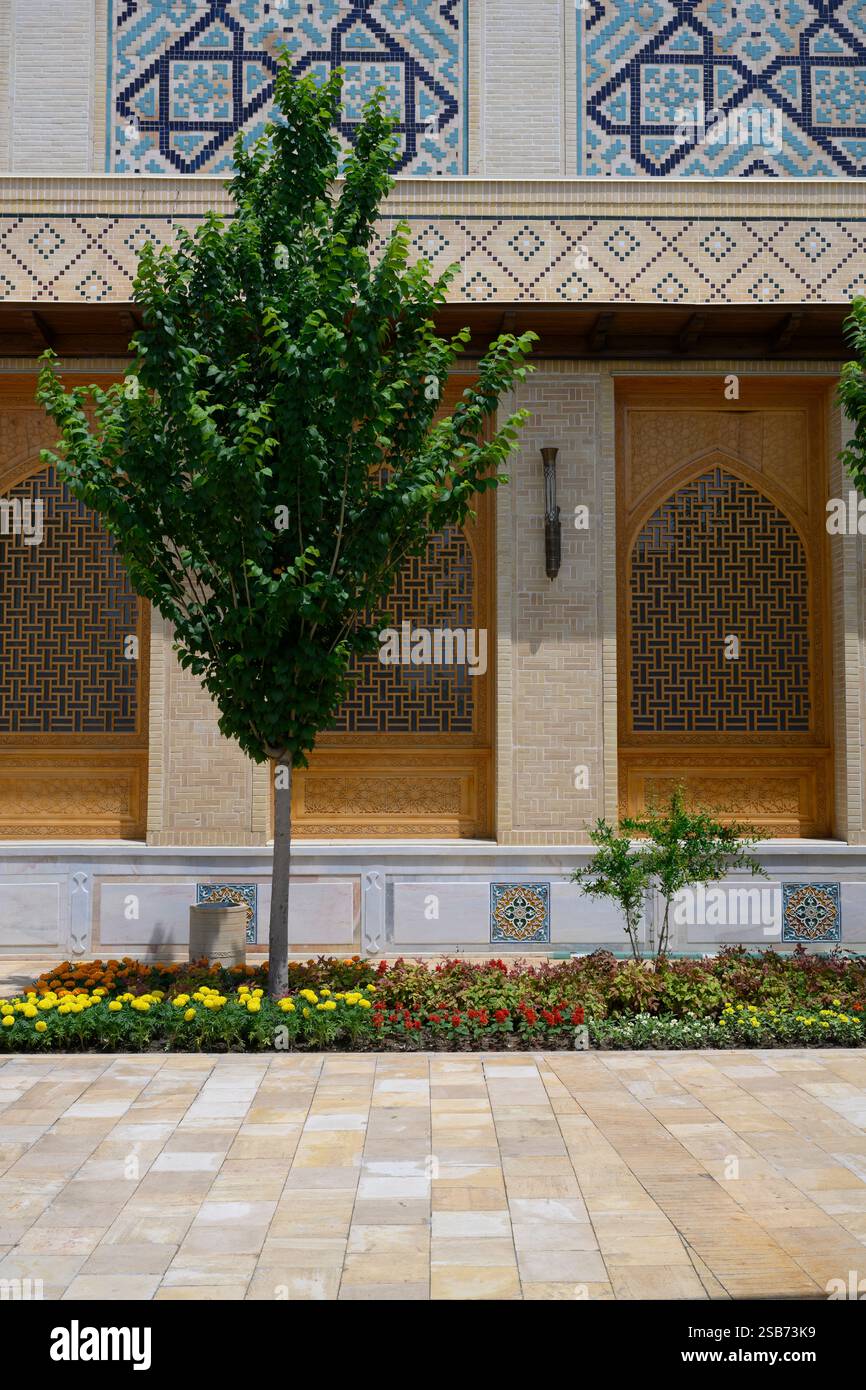 Fragment of buildings with wooden carvings, traditional Uzbek mosaics ...