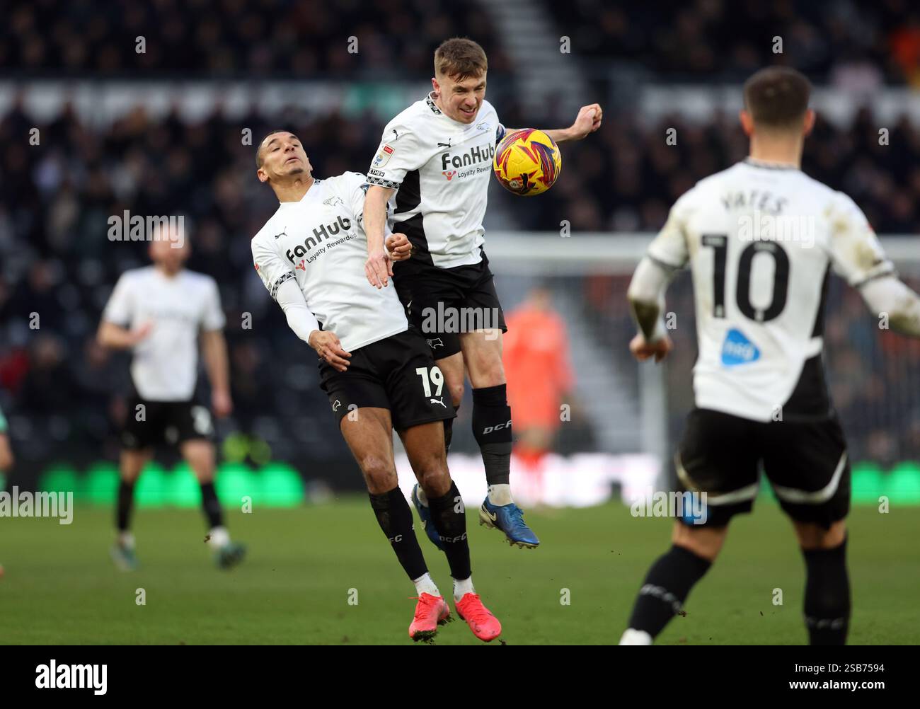 Derby County's Kayden Jackson and Ben Osborn collide as they jump for ...