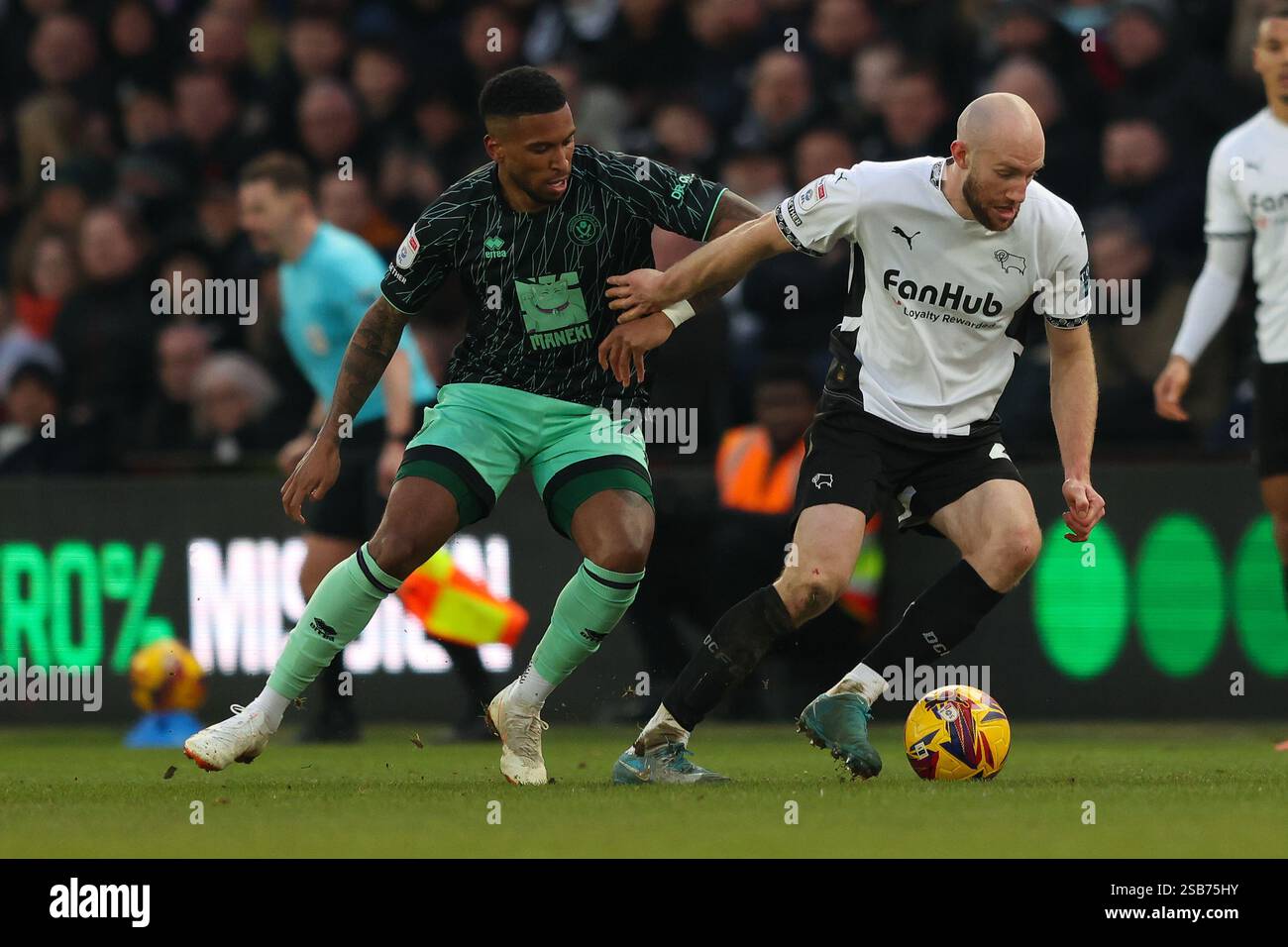 Matt Clarke of Derby County is pressured by Vinicius Souza of Sheffield ...