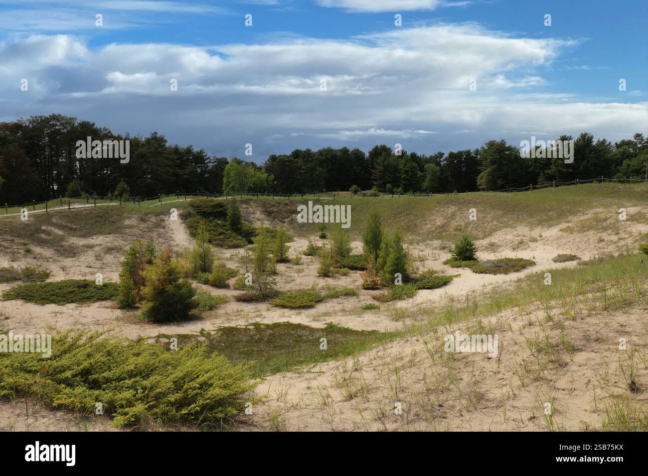 The Kohler Dunes Cordwalk trail going around sand dune hills, covered ...