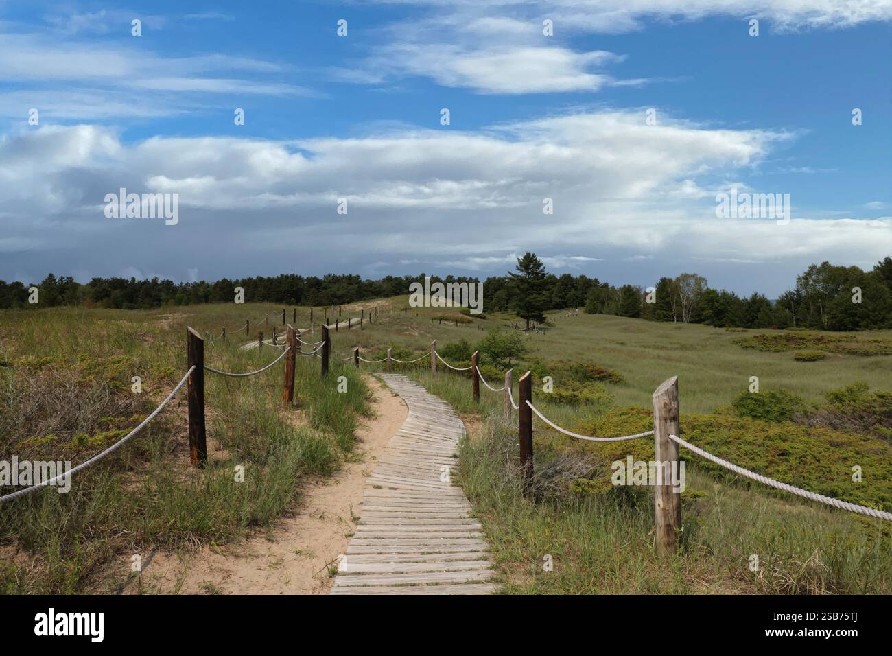 The Kohler Dunes Cordwalk trail going through sand dune hills, covered ...