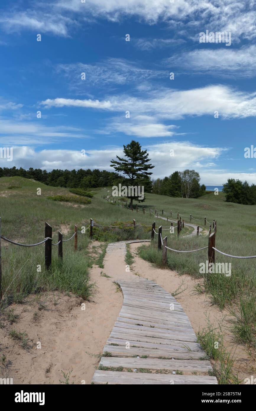 The Kohler Dunes Cordwalk trail going through sand dune hills, covered ...