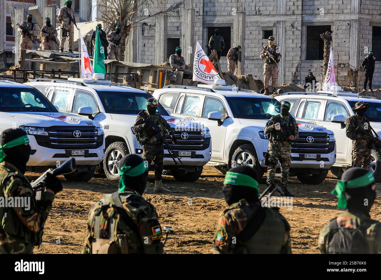 Palestinian militant group Hamas fighters secure an area before handing ...