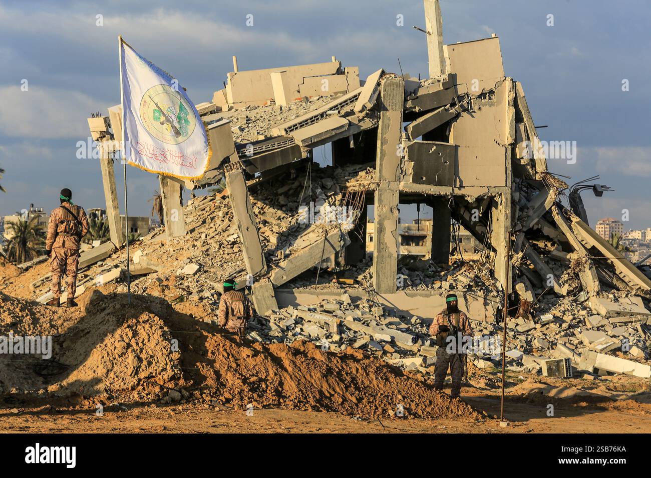 Palestinian militant group Hamas fighters secure an area before handing ...