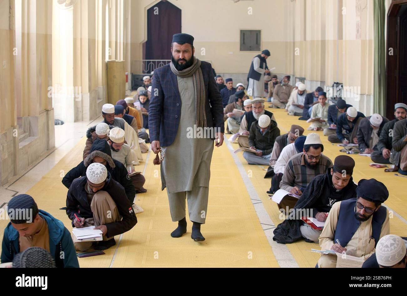 Students of Islamic seminary solve papers during Annual Examination of ...