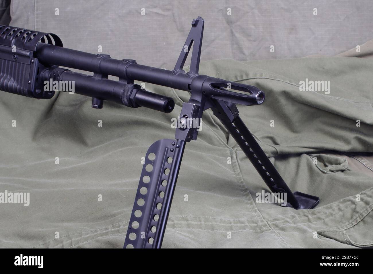 M60 machinegun on green uniform background Stock Photo - Alamy