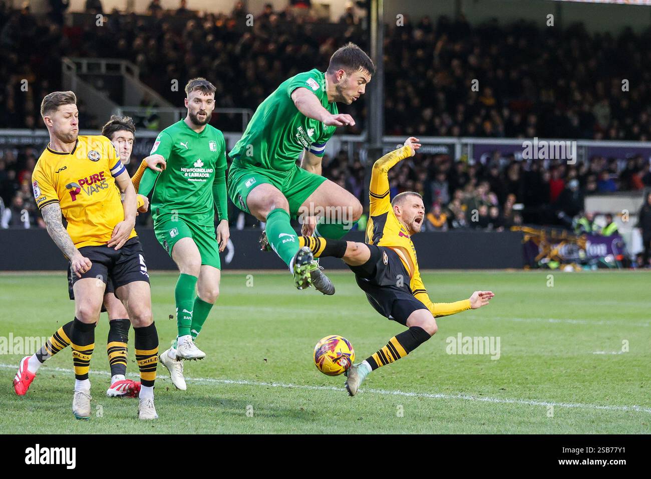 #6, Niall Canavan of Barrow AFC in action in the area, denied by #19 ...
