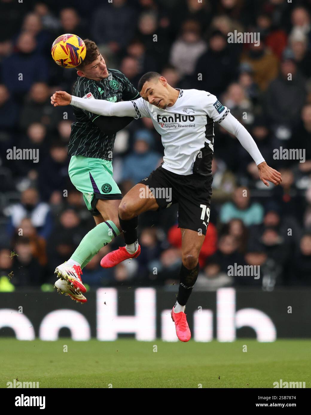 Harrison Burrows of Sheffield United challenges Kayden Jackson of Derby ...