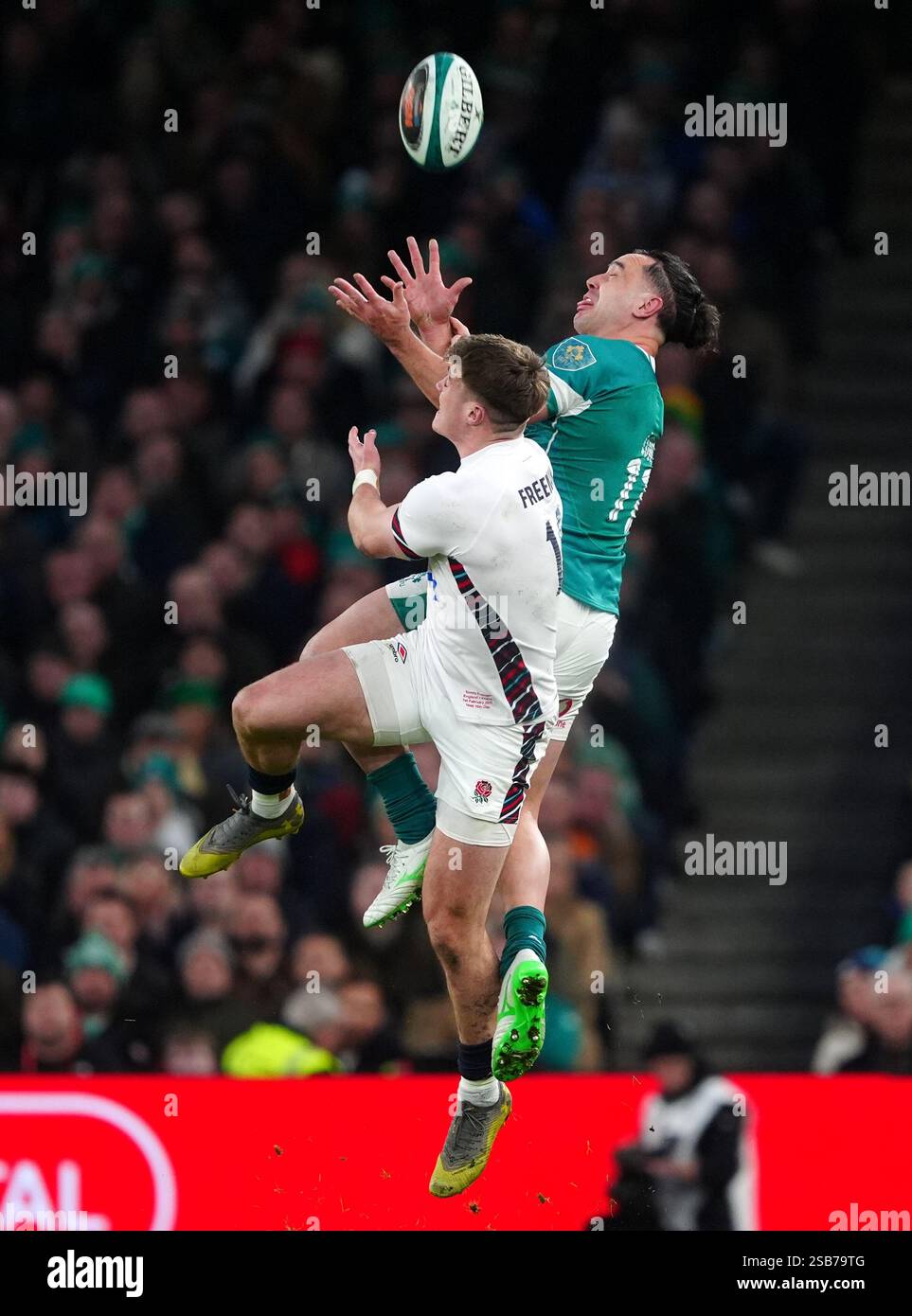 England's Tommy Freeman (left) and Ireland's James Lowe compete to ...