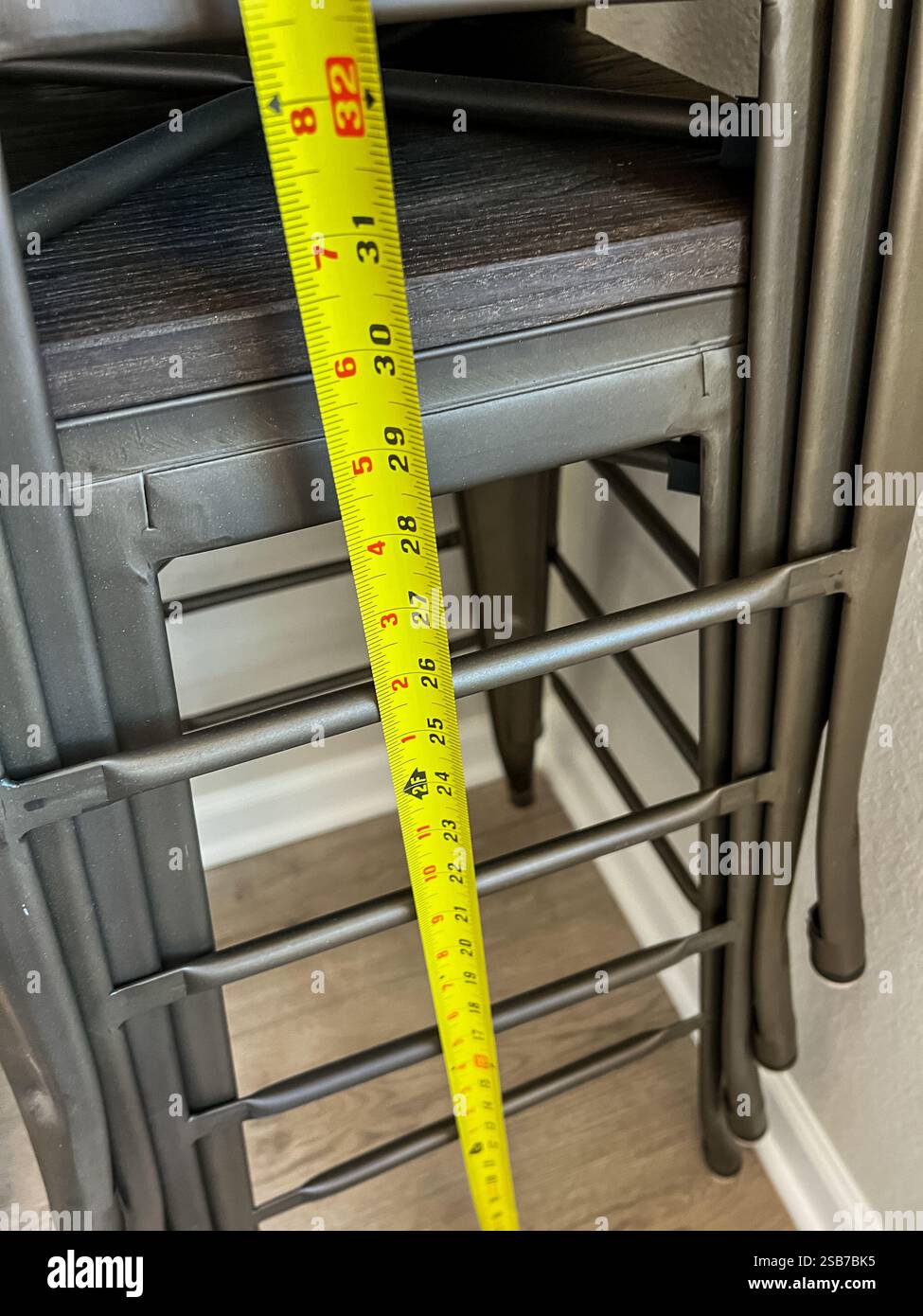 Stackable Metal Bar Stools in Corner Space Stock Photo - Alamy