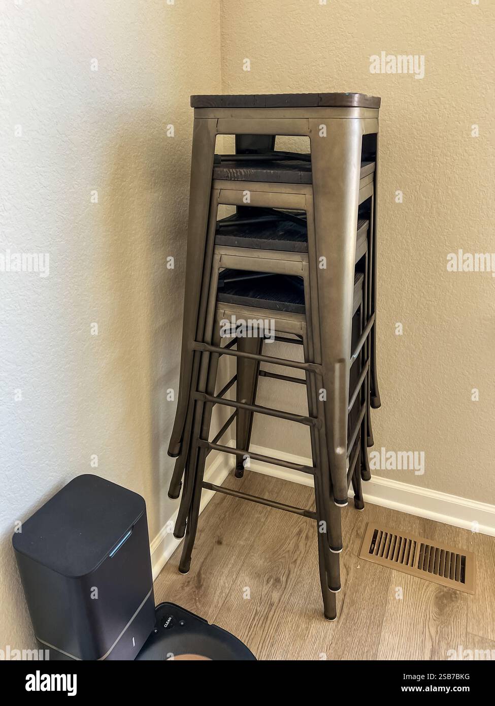 Stackable Metal Bar Stools in Corner Space Stock Photo - Alamy