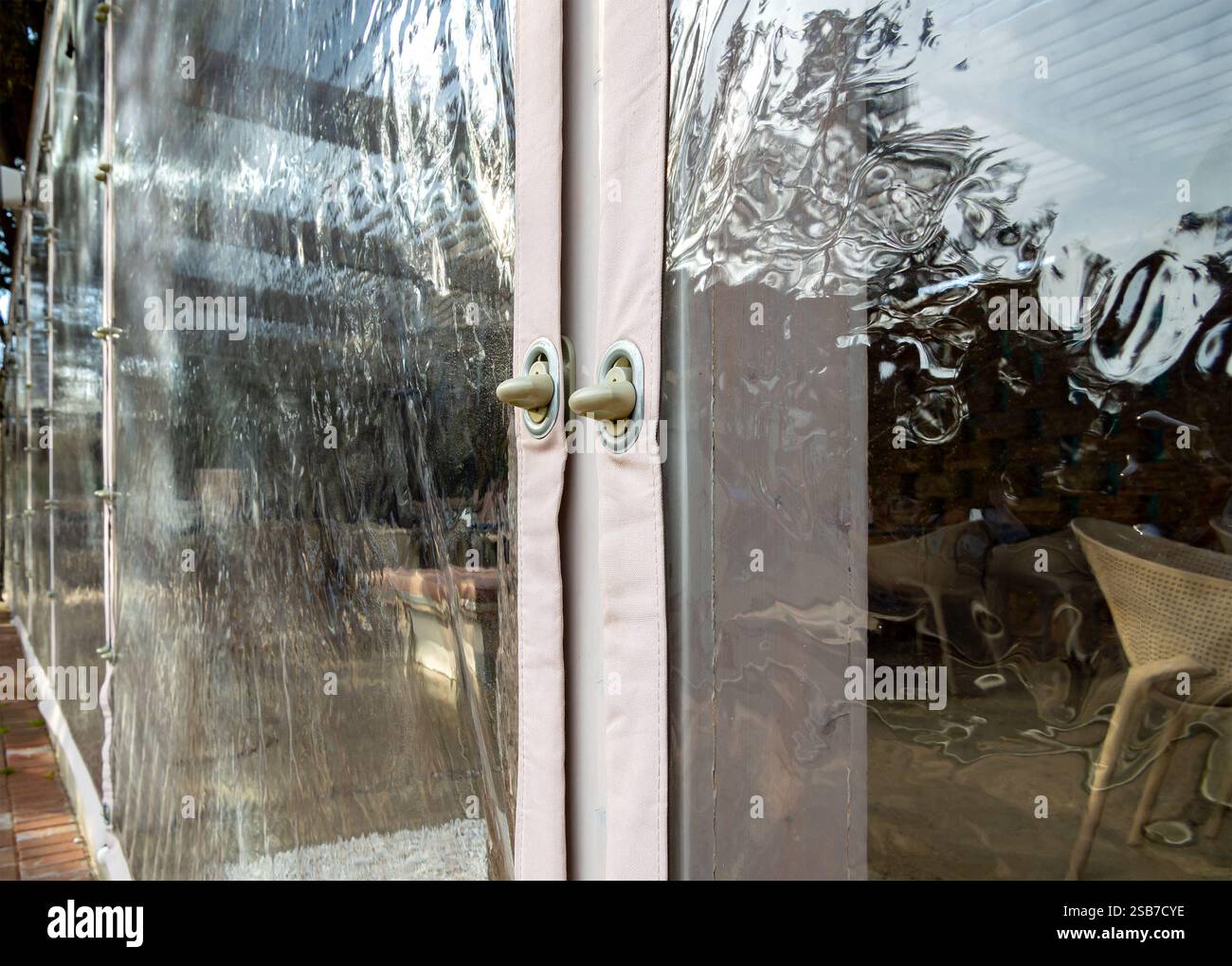 Transparent soft PVC windows in the close position Stock Photo - Alamy