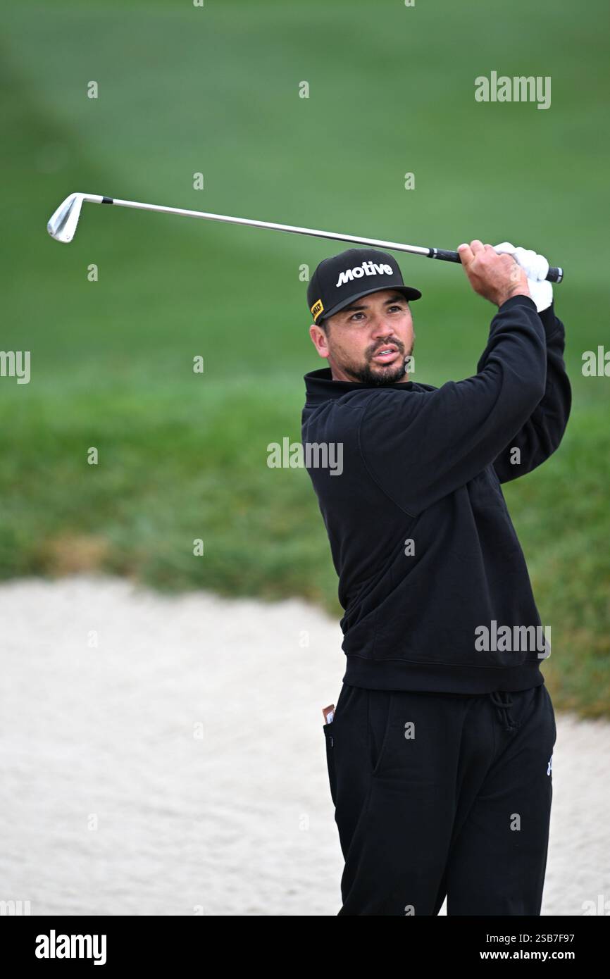 Jason Day, of Australia, hits a bunker shot on the second hole at ...