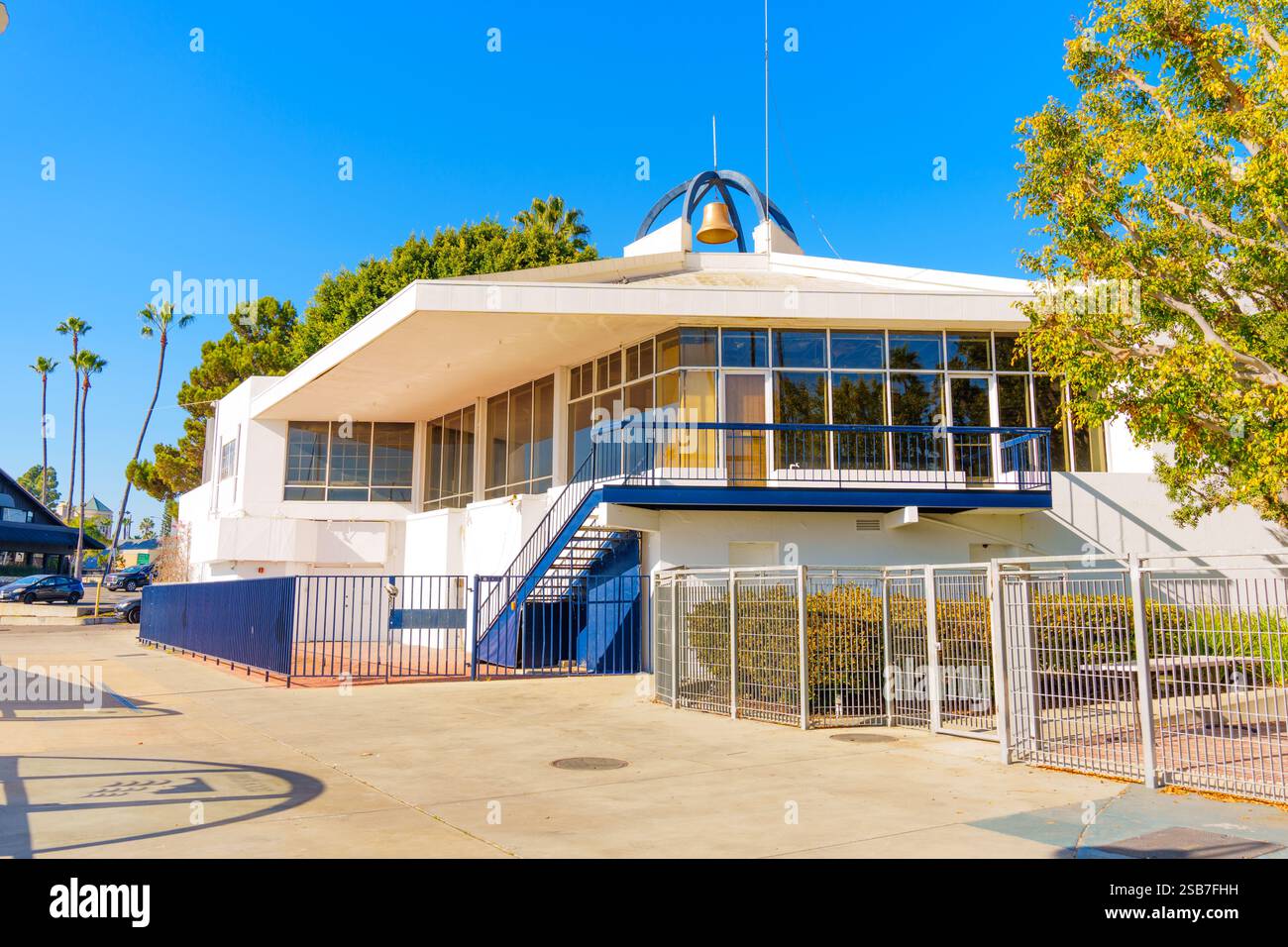 Contemporary building design showcasing clear skies and palm trees at ...
