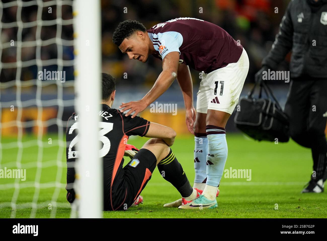 Aston Villa's Ollie Watkins (right) speaks with goalkeeper Emiliano ...