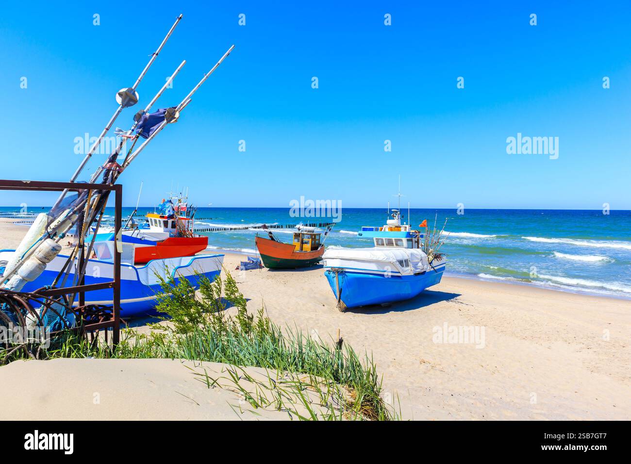 Fishing boats on sandy beach in Chlopy village port, Baltic Sea coast ...