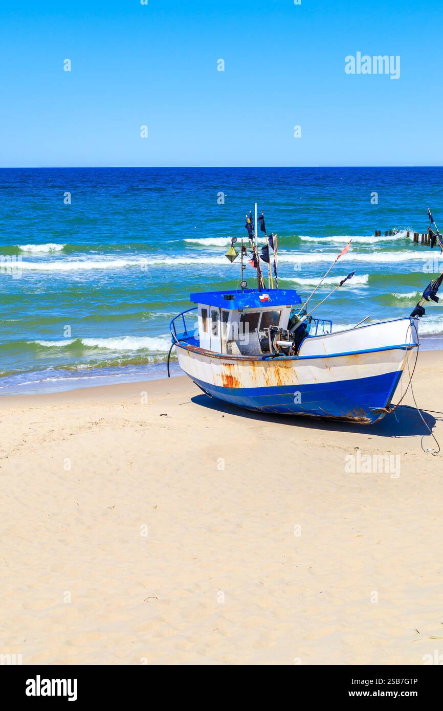 Fishing boats on sandy beach in Chlopy village port, Baltic Sea coast ...