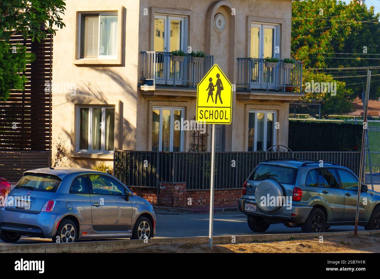 Los Angeles, California - December 18, 2024: Bright yellow school zone ...