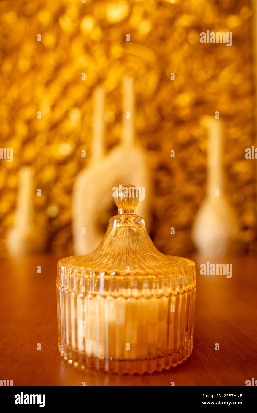 A charming sugar bowl sits on a cafe table bathed in warm morning light ...