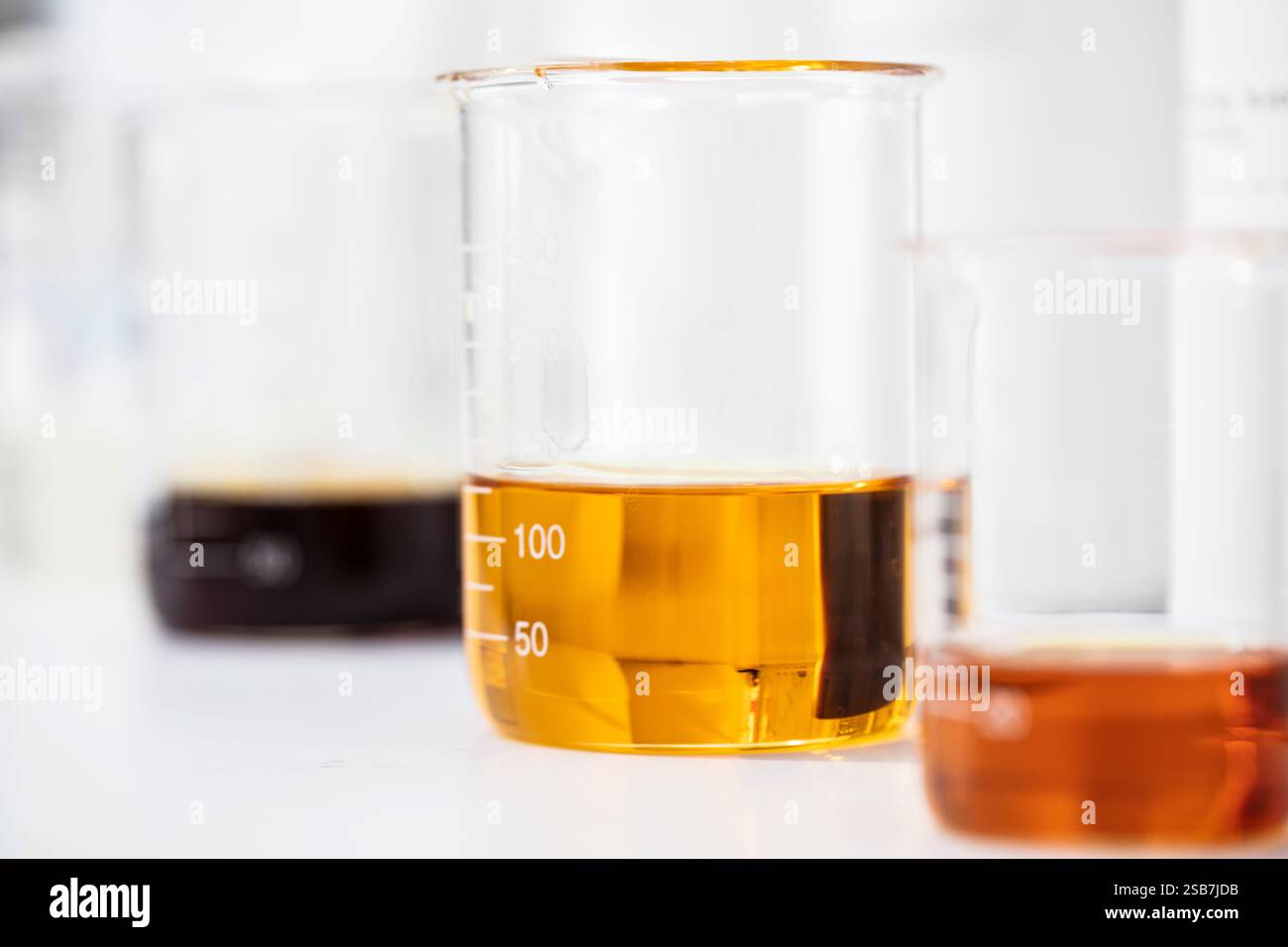 Laboratory glassware filled with colorful liquid Stock Photo - Alamy