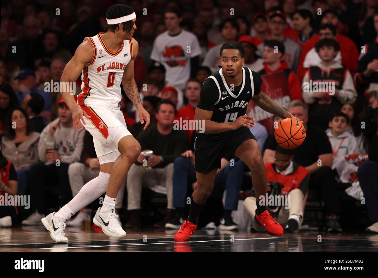 Providence guard Corey Floyd Jr. (14) dribbles the ball against St ...