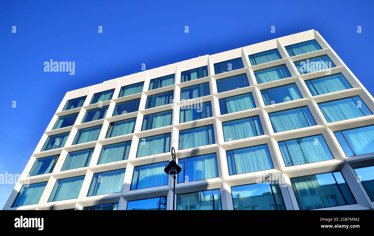 Large glass windows in a modern hotel building. Modern urban ...