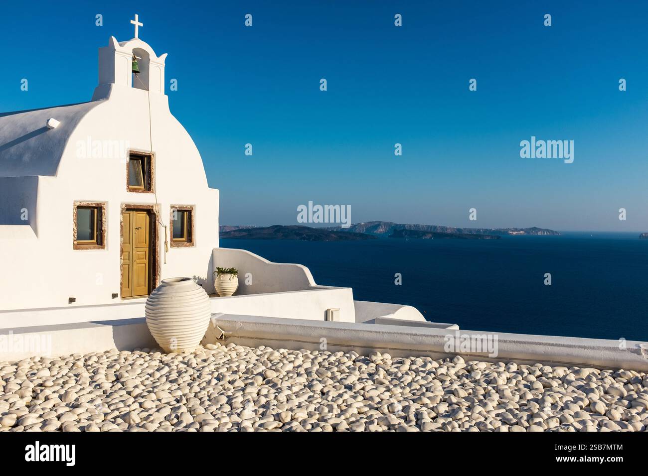 Terrace at Oia village, Santorini island in Cyclades, Aegean sea ...