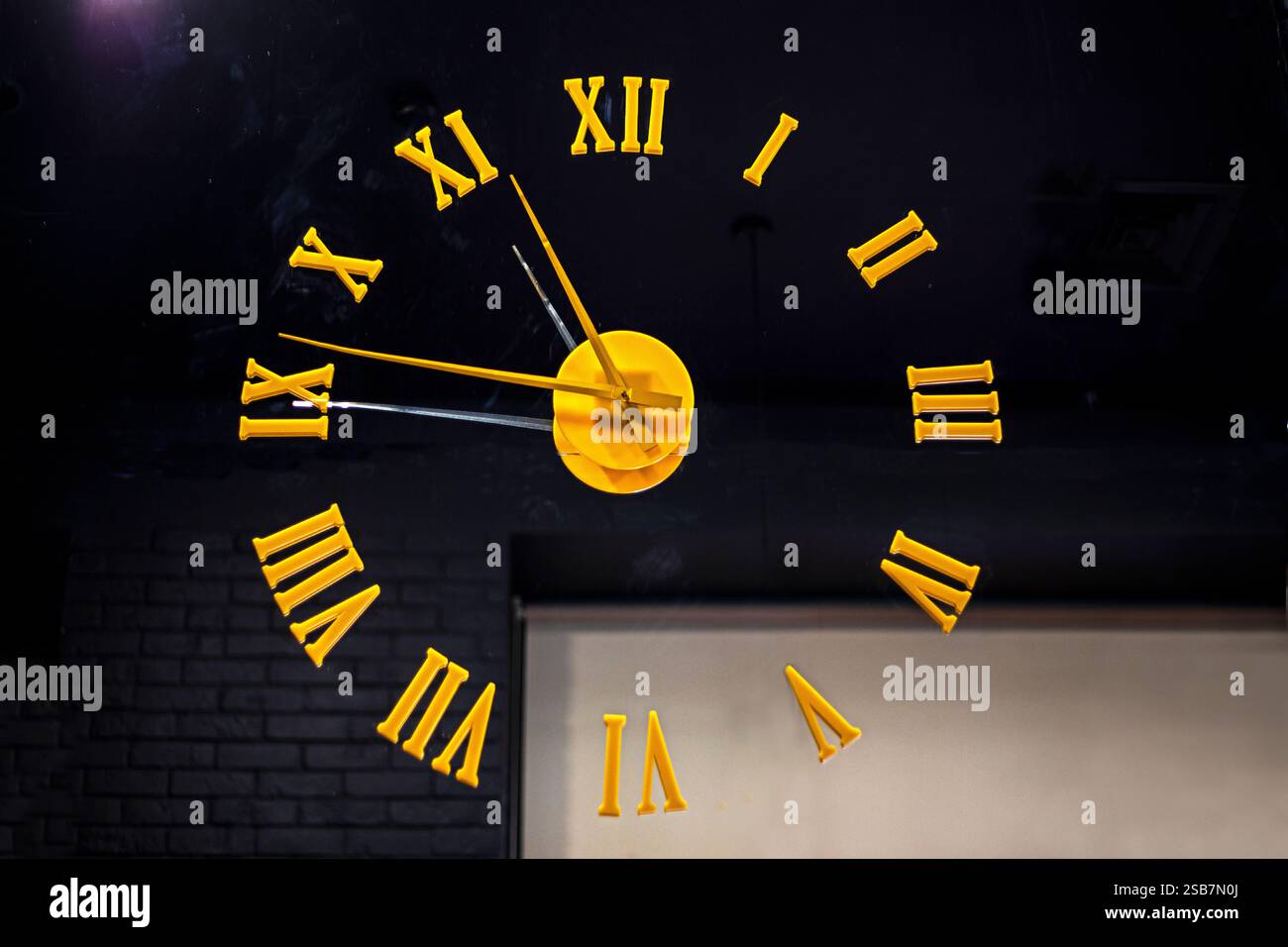 yellow quartz wall clock in the interior Stock Photo - Alamy