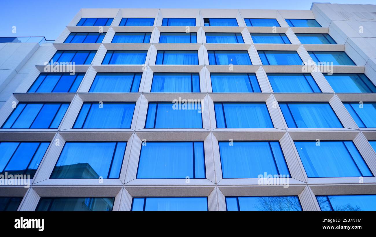 Large glass windows in a modern hotel building. Modern urban ...