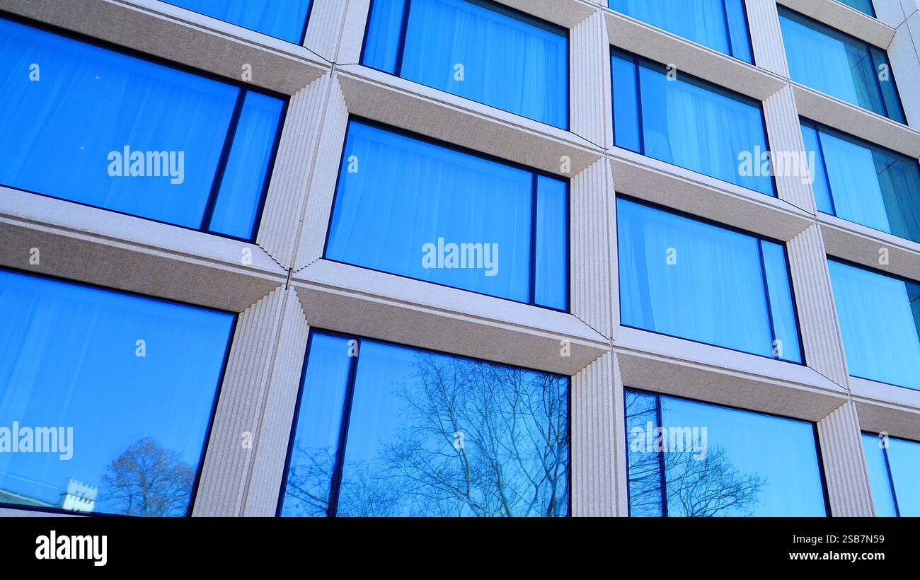Large glass windows in a modern hotel building. Modern urban ...