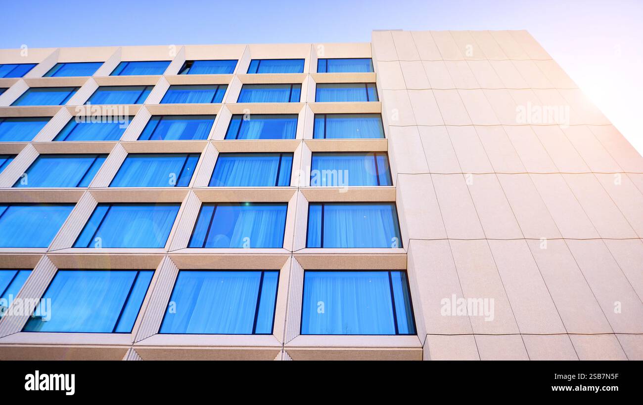 Large glass windows in a modern hotel building. Modern urban ...