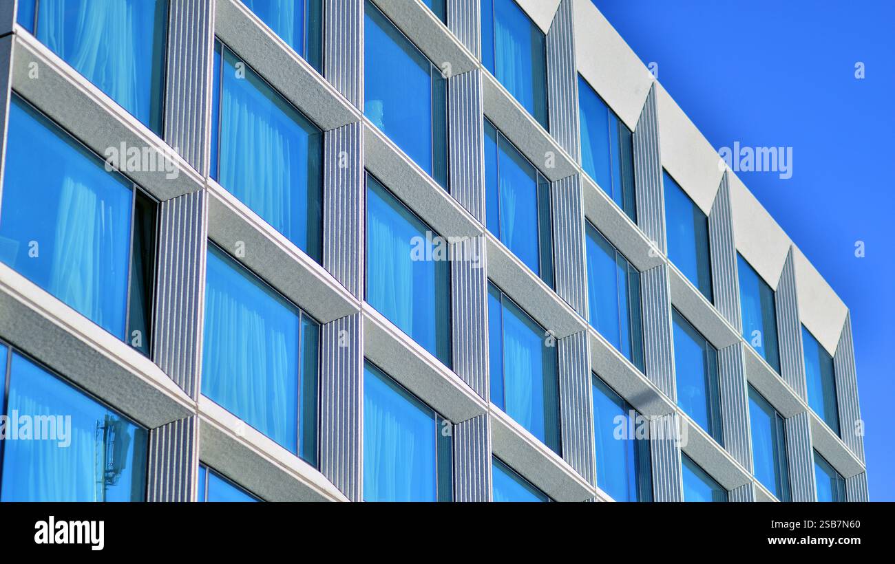 Large glass windows in a modern hotel building. Modern urban ...