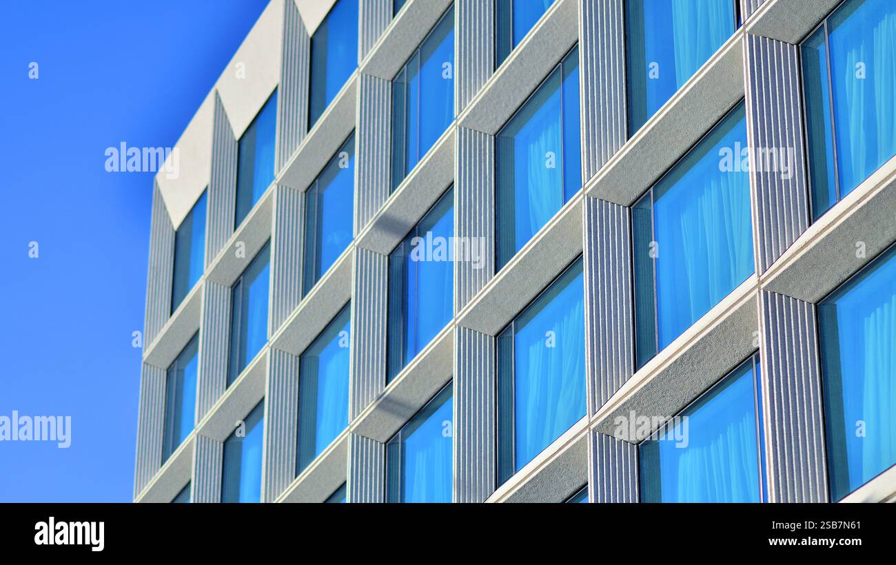 Large glass windows in a modern hotel building. Modern urban ...