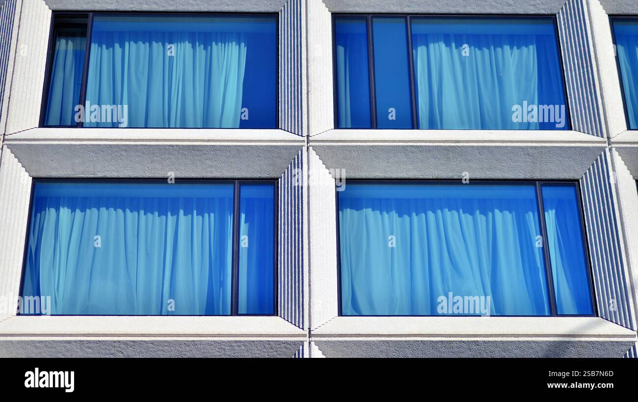 Large glass windows in a modern hotel building. Modern urban ...