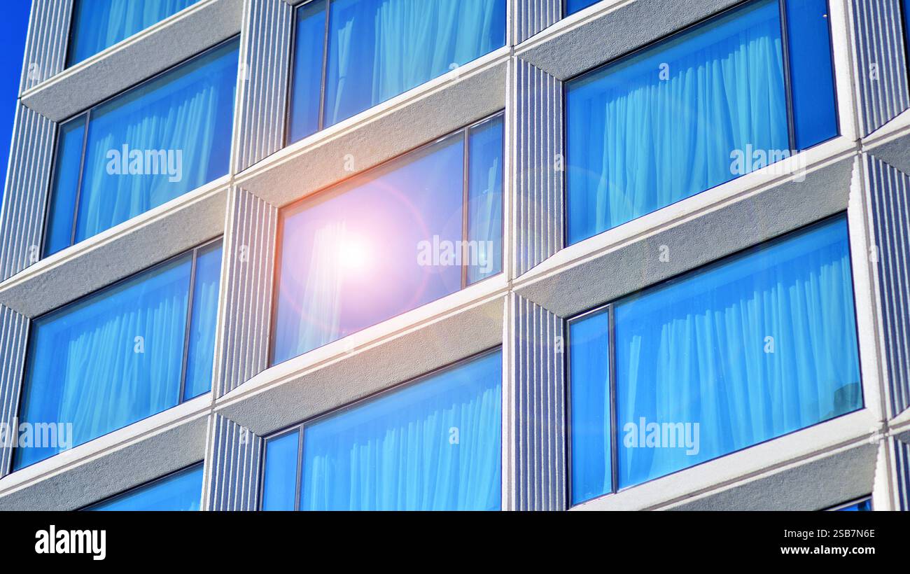 Large glass windows in a modern hotel building. Modern urban ...