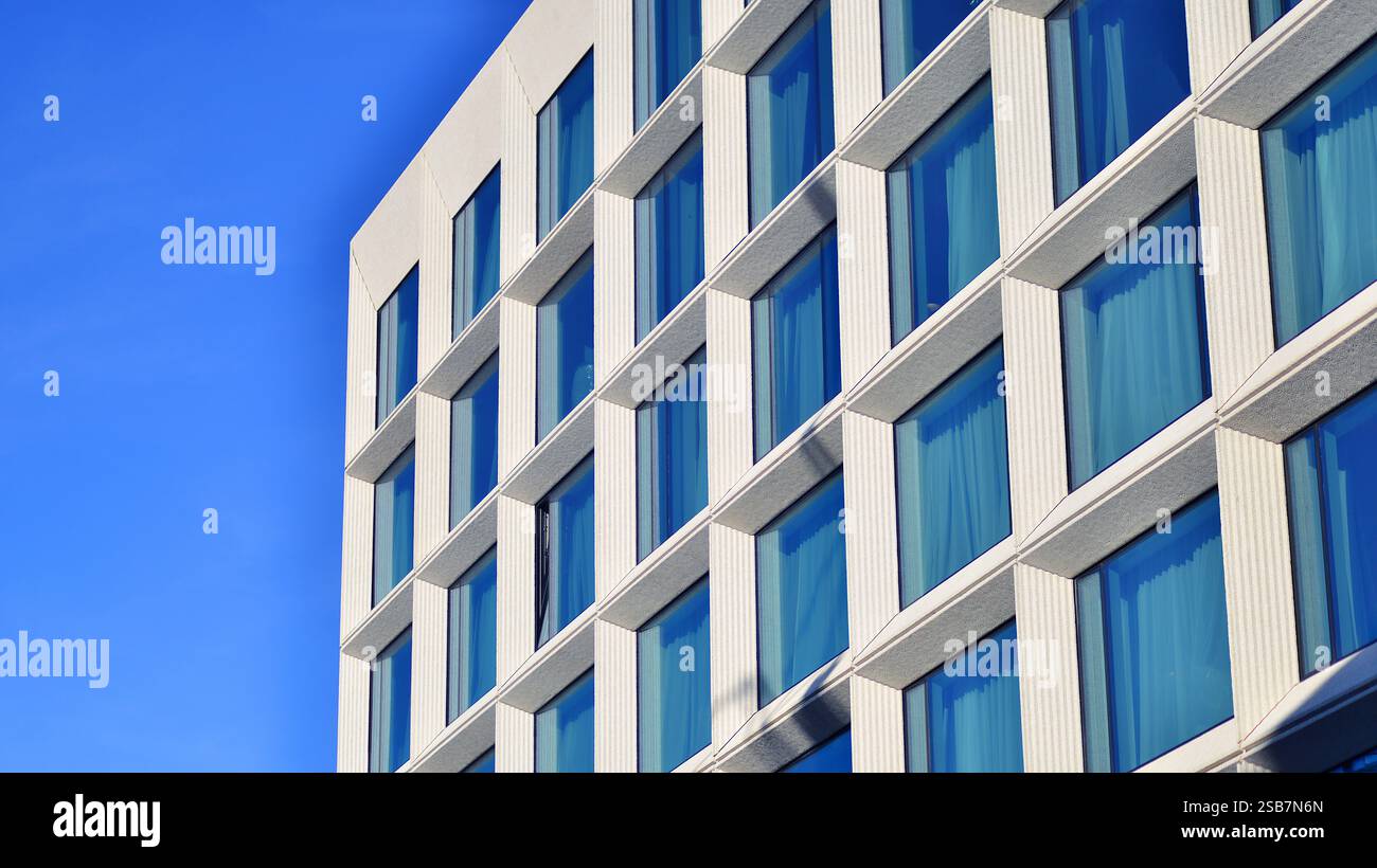 Large glass windows in a modern hotel building. Modern urban ...