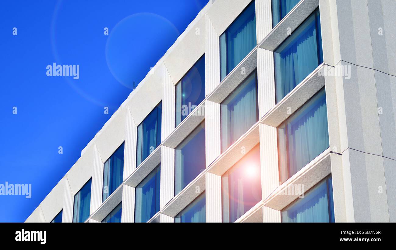 Large glass windows in a modern hotel building. Modern urban ...