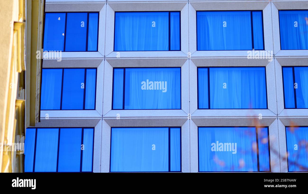 Large glass windows in a modern hotel building. Modern urban ...
