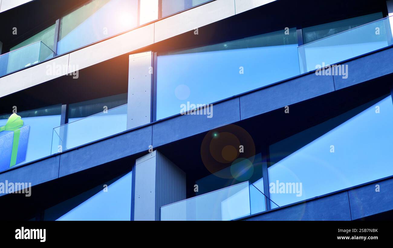 Large glass windows in a modern residential building. Modern urban ...
