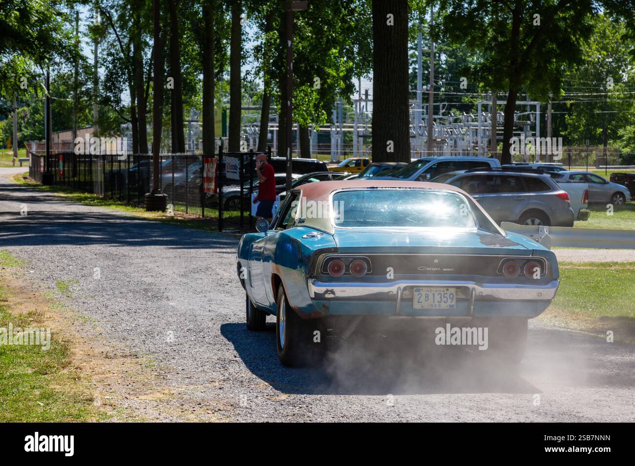 A blue 1968 Dodge Charger coupe on a dusty gravel road in Auburn ...