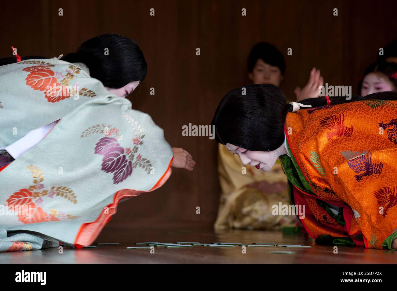 Women dressed in Heian Period costumes playing a New Year traditional ...