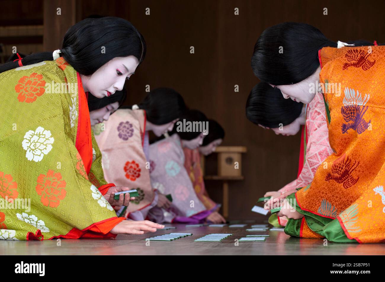 Women dressed in Heian Period costumes playing a New Year traditional ...