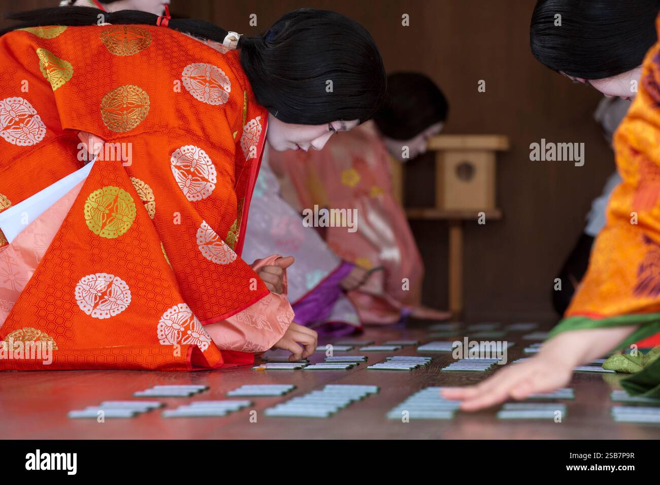 Women dressed in Heian Period costumes playing a New Year traditional ...