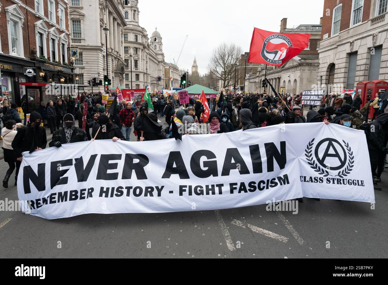 London, UK. 1 February, 2025. Anarchists hold a large banner saying ...