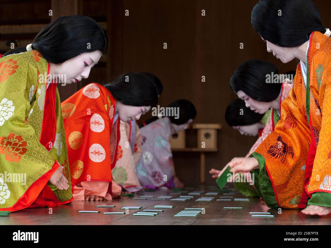 Women dressed in Heian Period costumes playing a New Year traditional ...