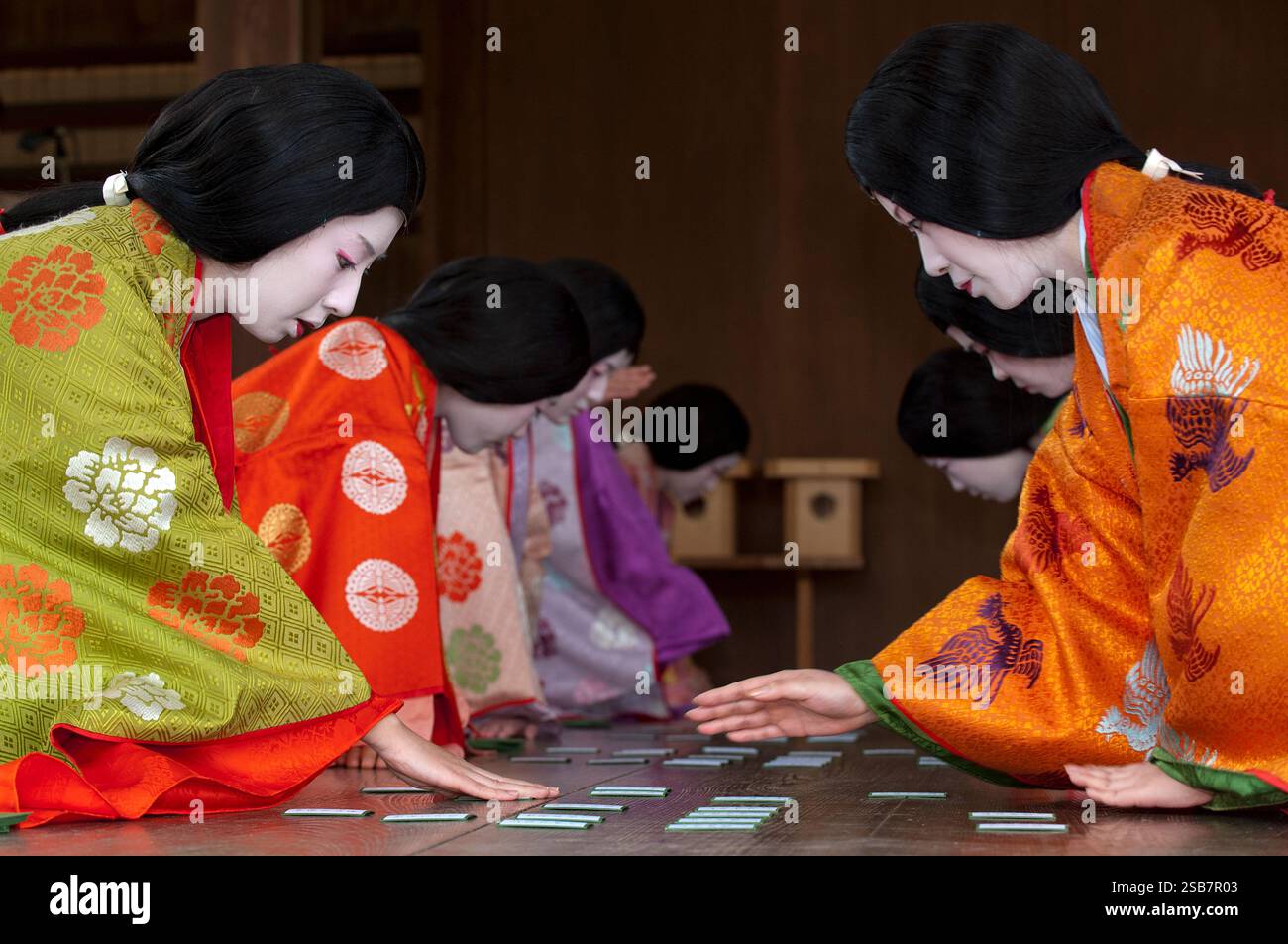 Women dressed in Heian Period costumes playing a New Year traditional ...