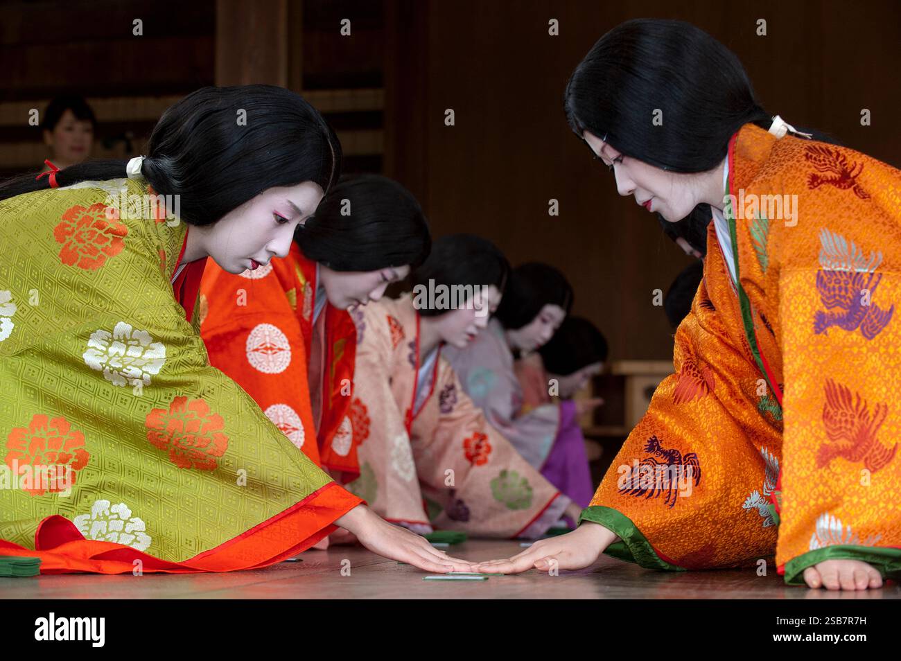 Women dressed in Heian Period costumes playing a New Year traditional ...