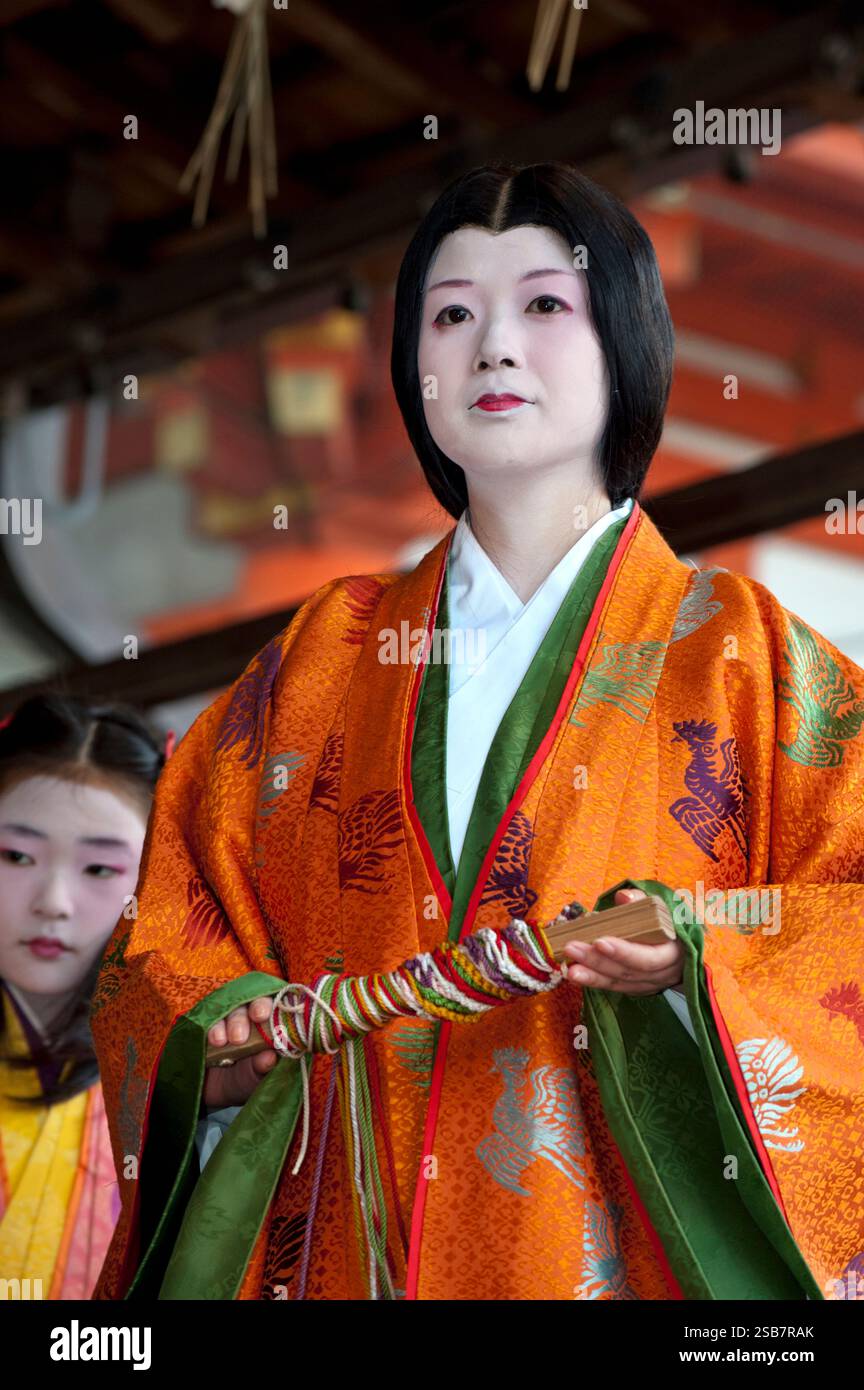 Females dressed in colorful kimono as aristocrats from the Heian Period ...
