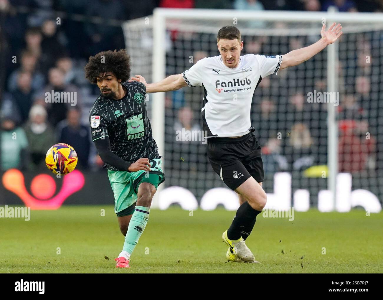 Derby, UK. 1st Feb, 2025. Hamza Choudhury of Sheffield United tussles ...