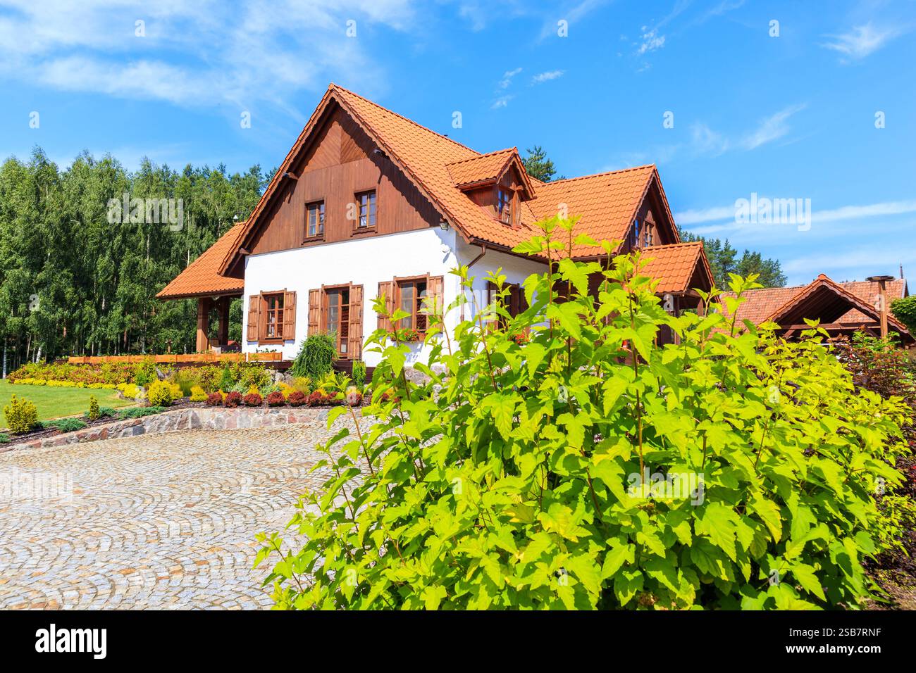 Traditional style rustic houses in Wygryny village near lake Nidzkie ...